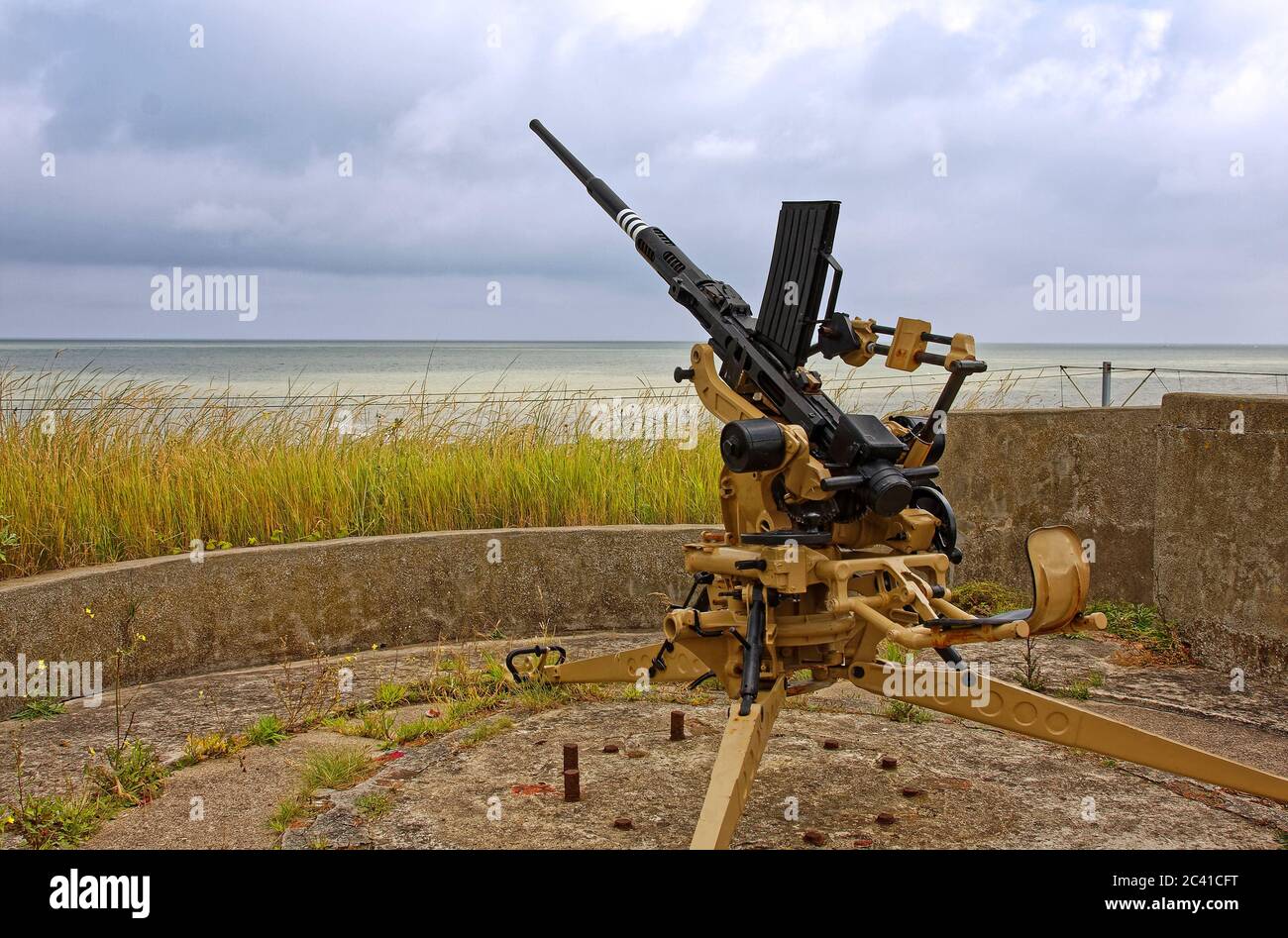 army gun, gold color frame and seat, German bunker; old military ...