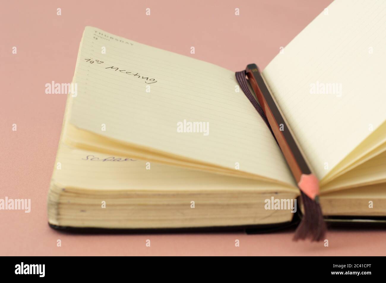 Open appointment book with a pencil Stock Photo - Alamy