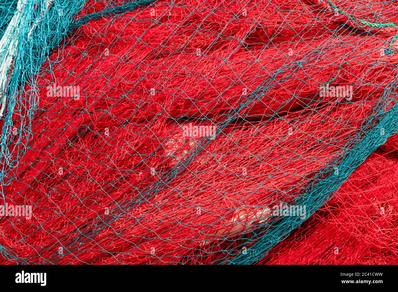 Red Fishing Net Pile Background Texture extreme closeup Stock Photo - Alamy