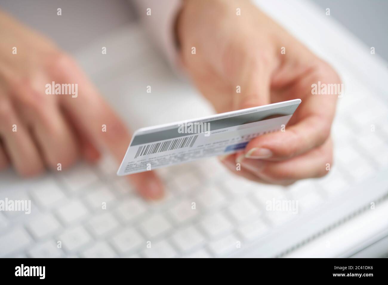 Hand holds a plastic card Stock Photo - Alamy