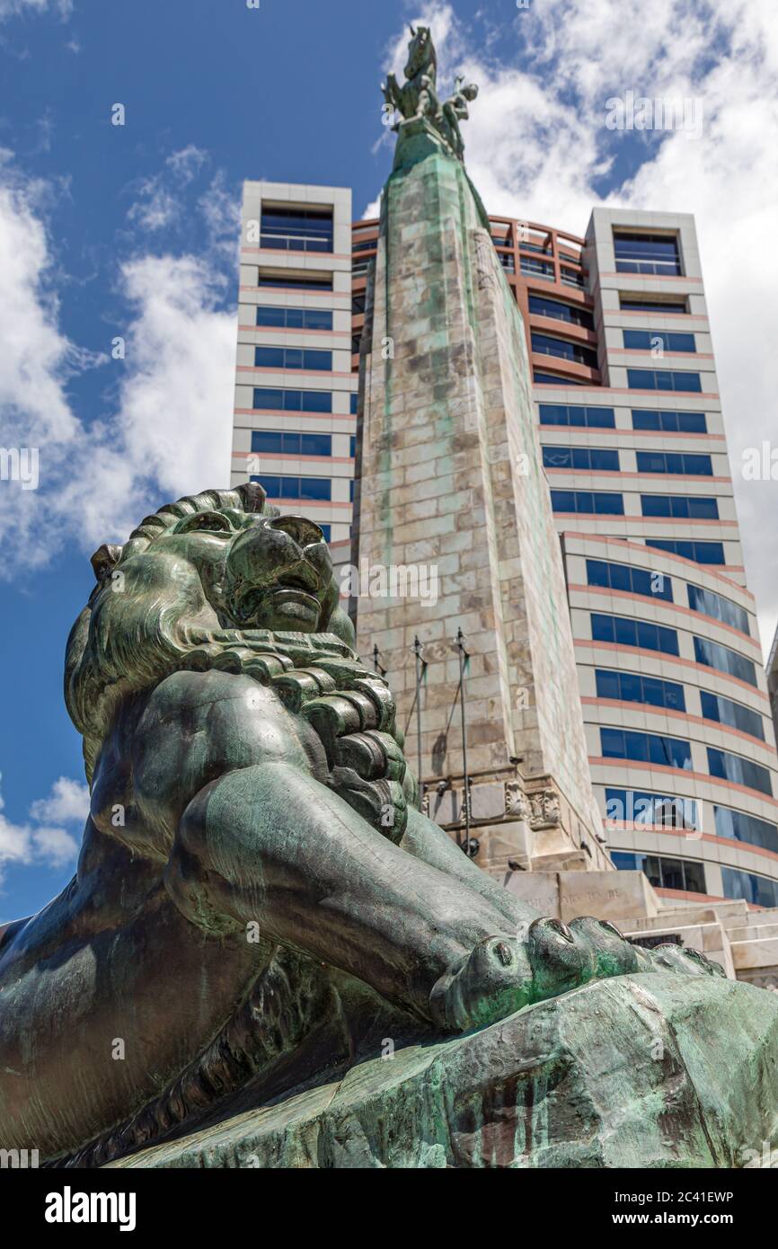 Closeup of a bronze lion of the Wellington Cenotaph at intersection ...