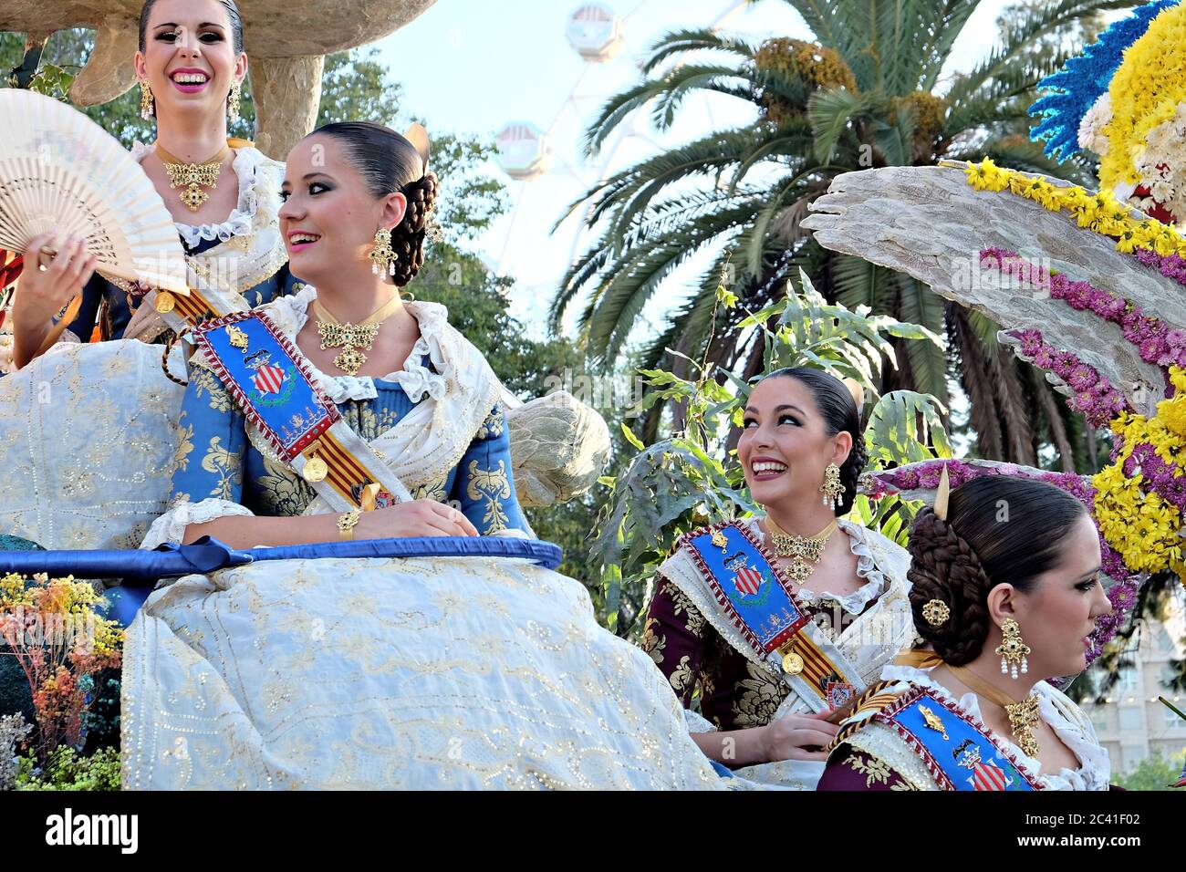 Battle of flowers, women wearing traditional dresses in decorated ...