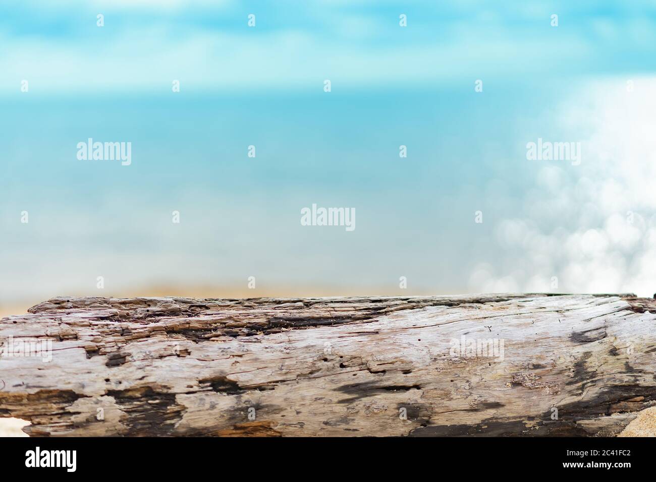 timber log on sand beach , put your product on log look like table ...