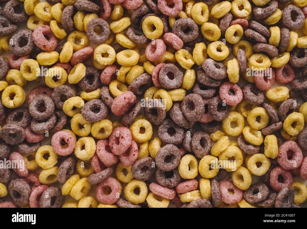 Multi-colored corn rings for breakfast, texture background Stock Photo ...