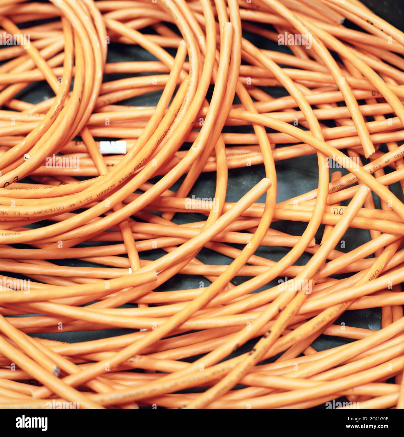 Orange computer cables in a server room Stock Photo - Alamy