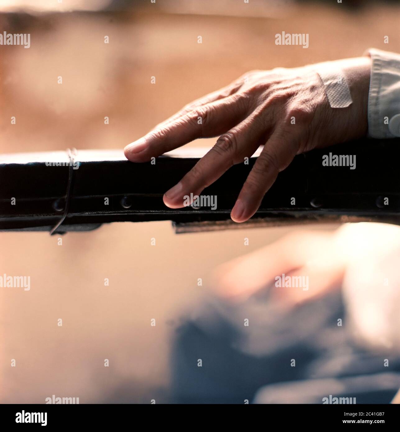 Human hand on an armrest Stock Photo - Alamy