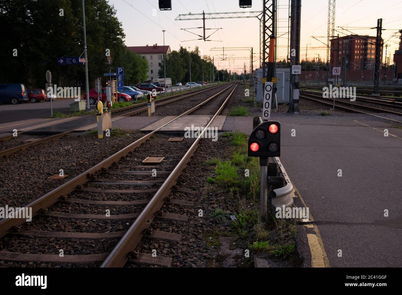 Traffic light shows red signal on railway in the nightfall Stock Photo ...