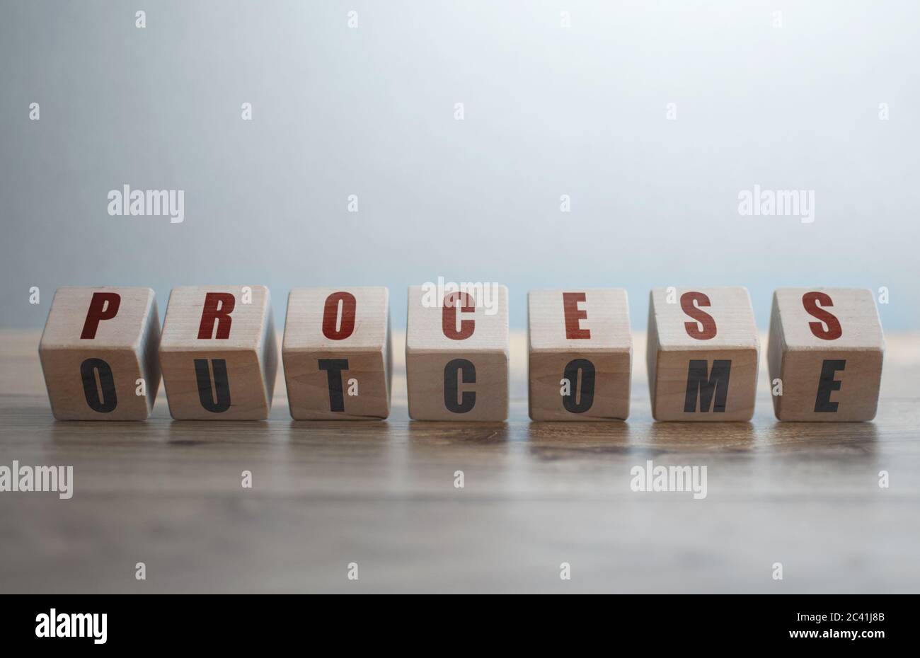 Wooden blocks turning over from outcome to process Stock Photo - Alamy