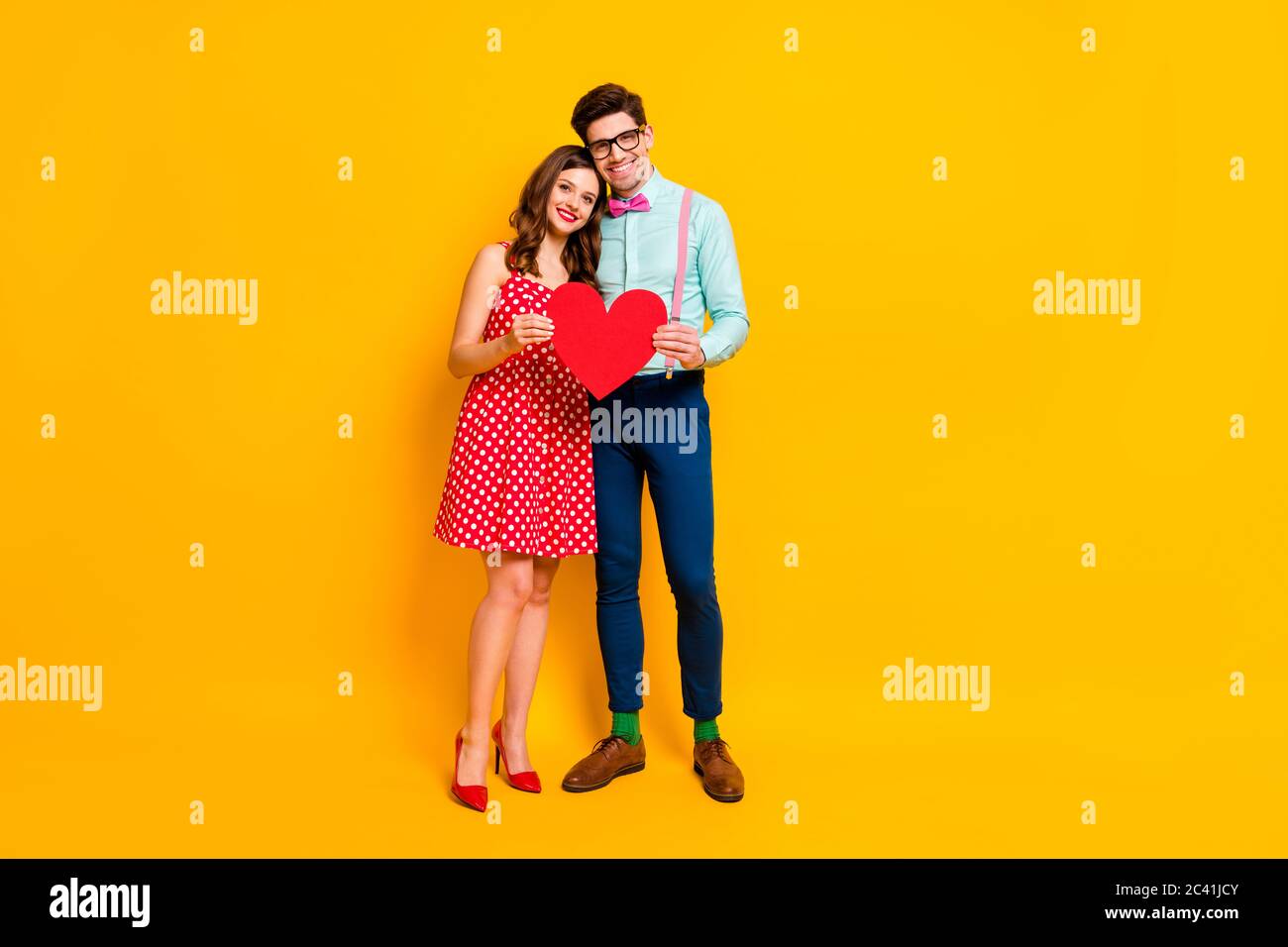 Full size photo comfort couple enjoy 14-february date hold red paper ...