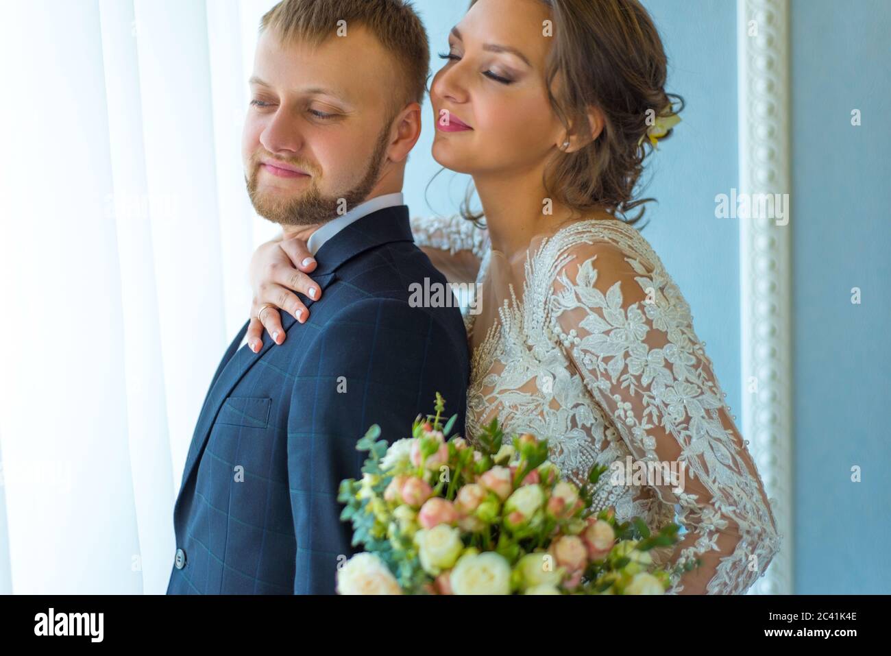 portrait of a happy bride and groom. Smiling young people of twenty ...