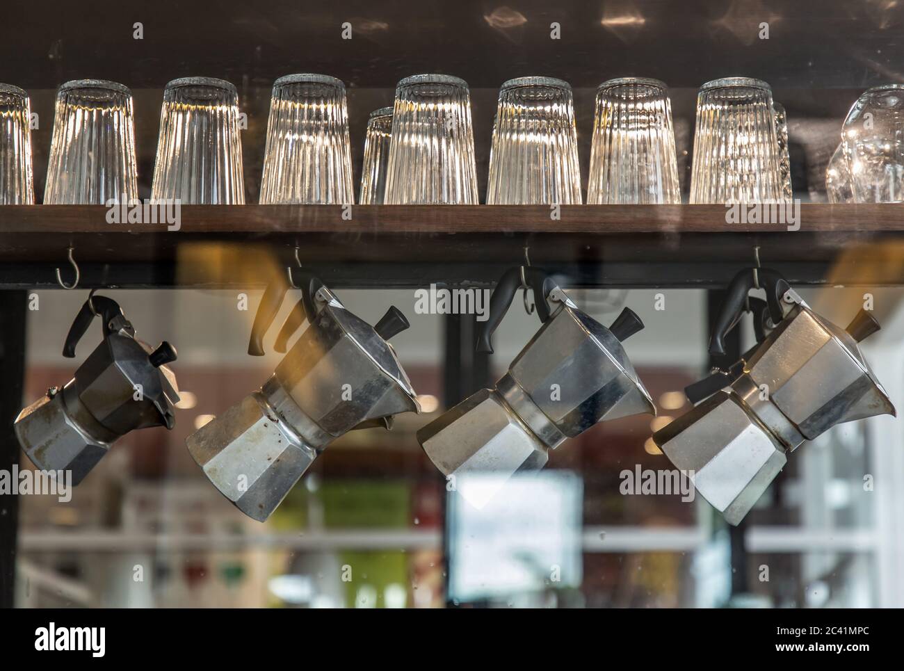 Interior design of coffee shop with glasses and moka pots. Moka pots ...