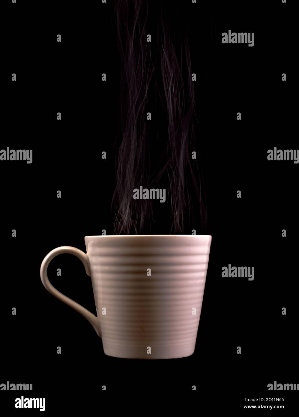 Single white coffee mug on a solid black background for easy isolation ...