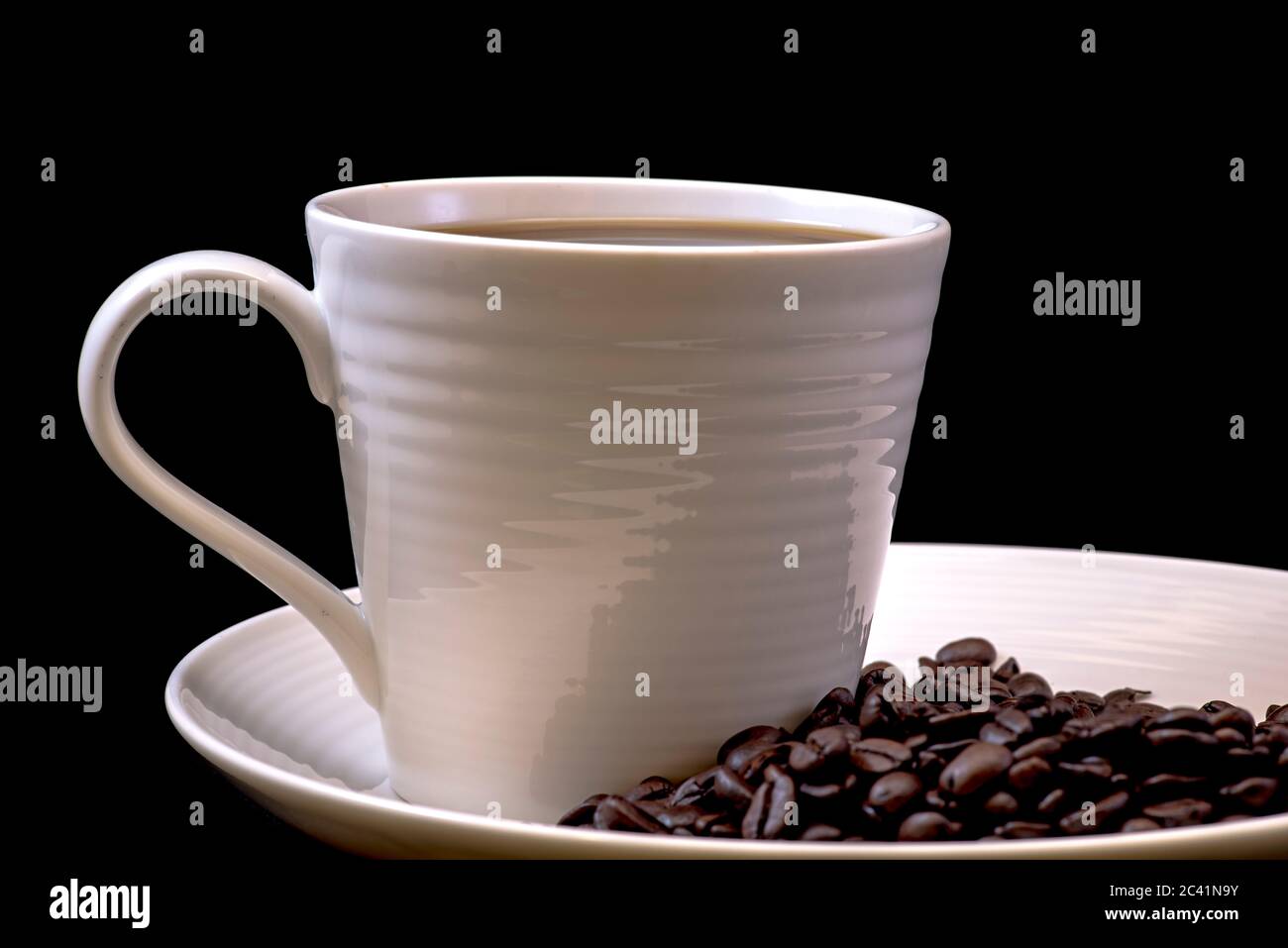 Single white coffee mug on a solid black background for easy isolation ...