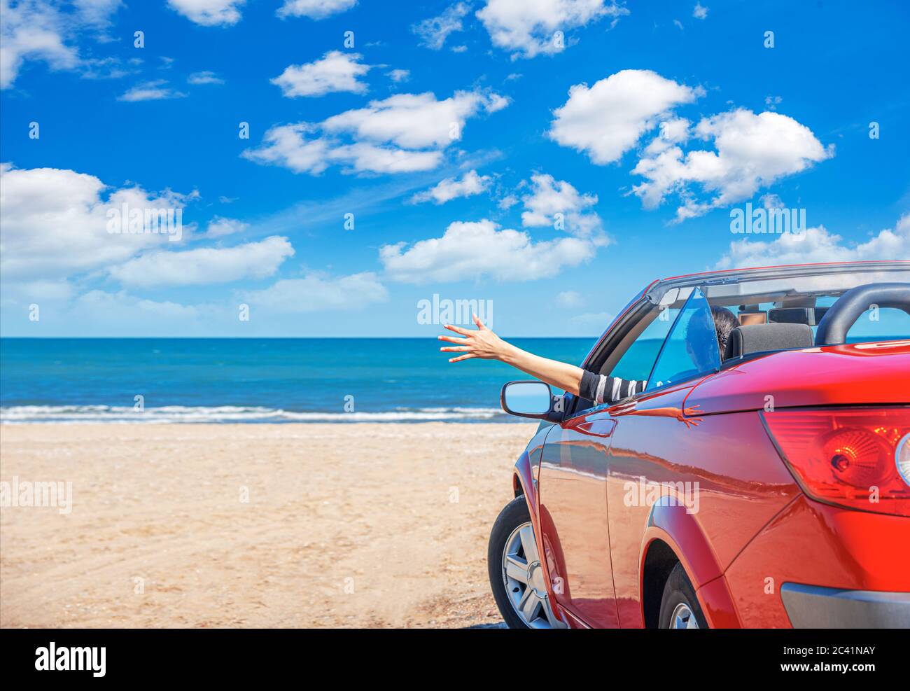 Red car on the beach Stock Photo - Alamy