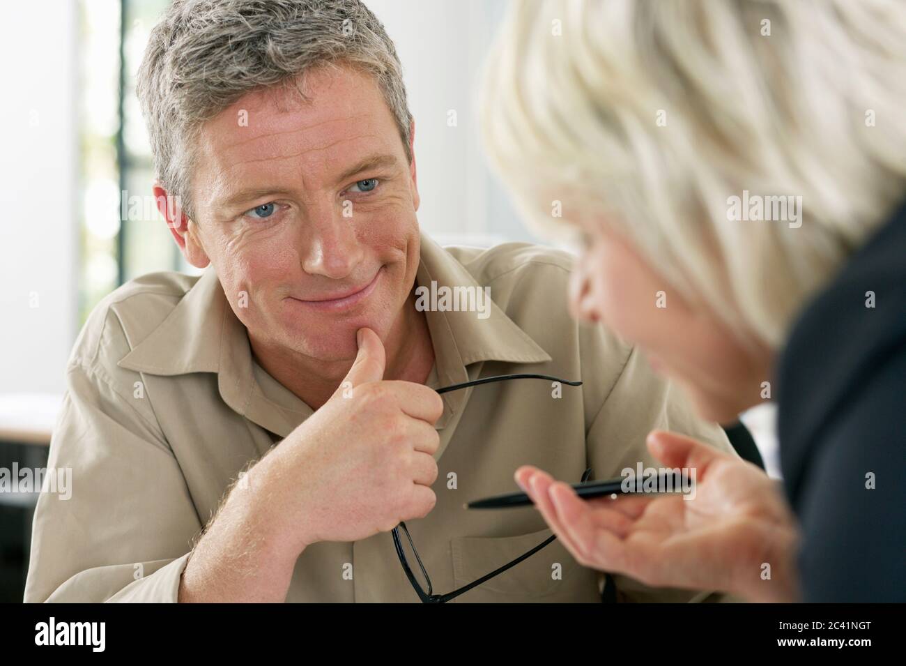 Two people in conversation Stock Photo - Alamy