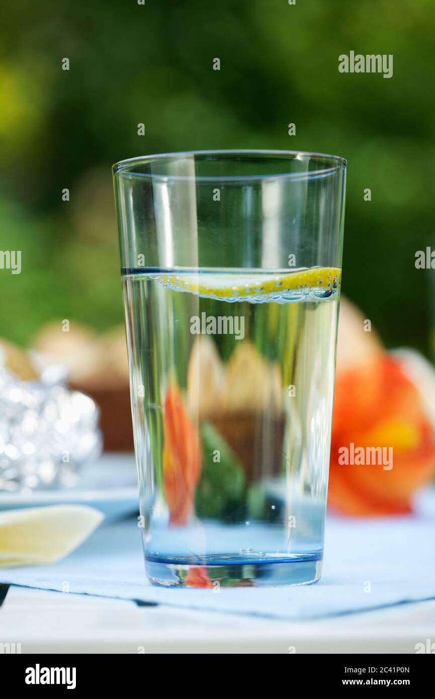 Water glass on a laid table Stock Photo - Alamy
