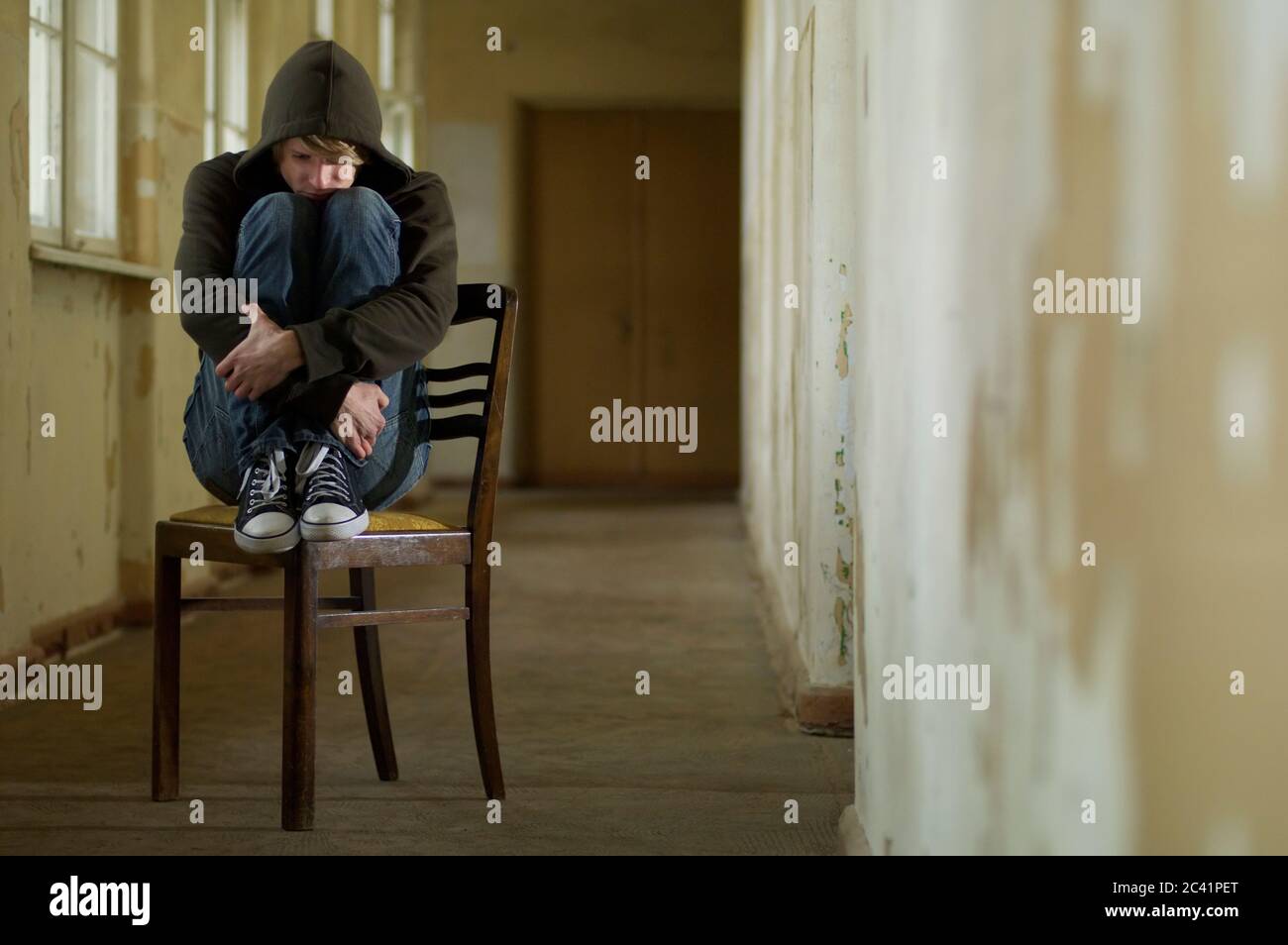 Man Huddled High Resolution Stock Photography and Images - Alamy