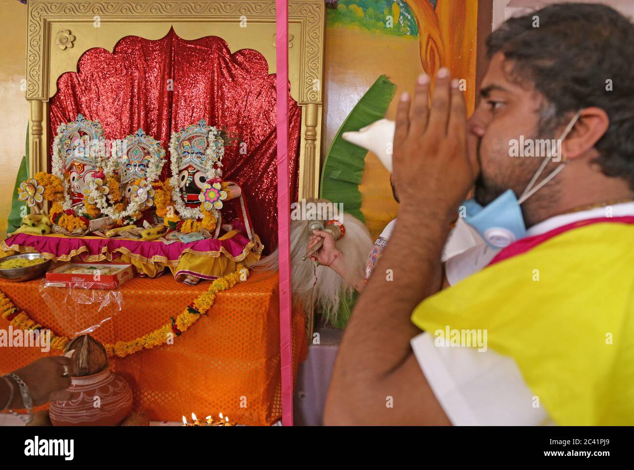 Beawar, Rajasthan, India, June 23, 2020: A devotee blow conch shells in ...