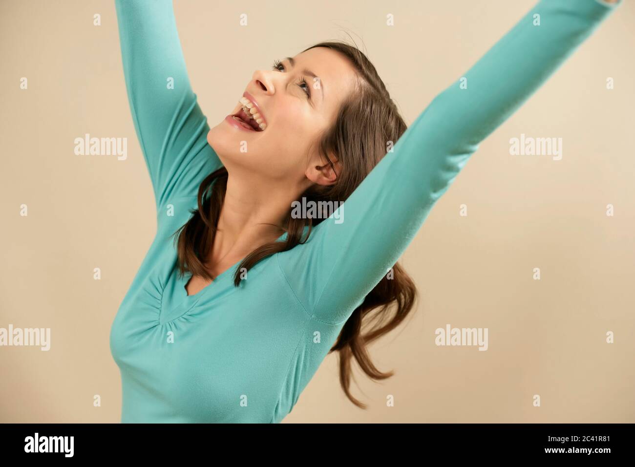 Young woman cheers Stock Photo - Alamy