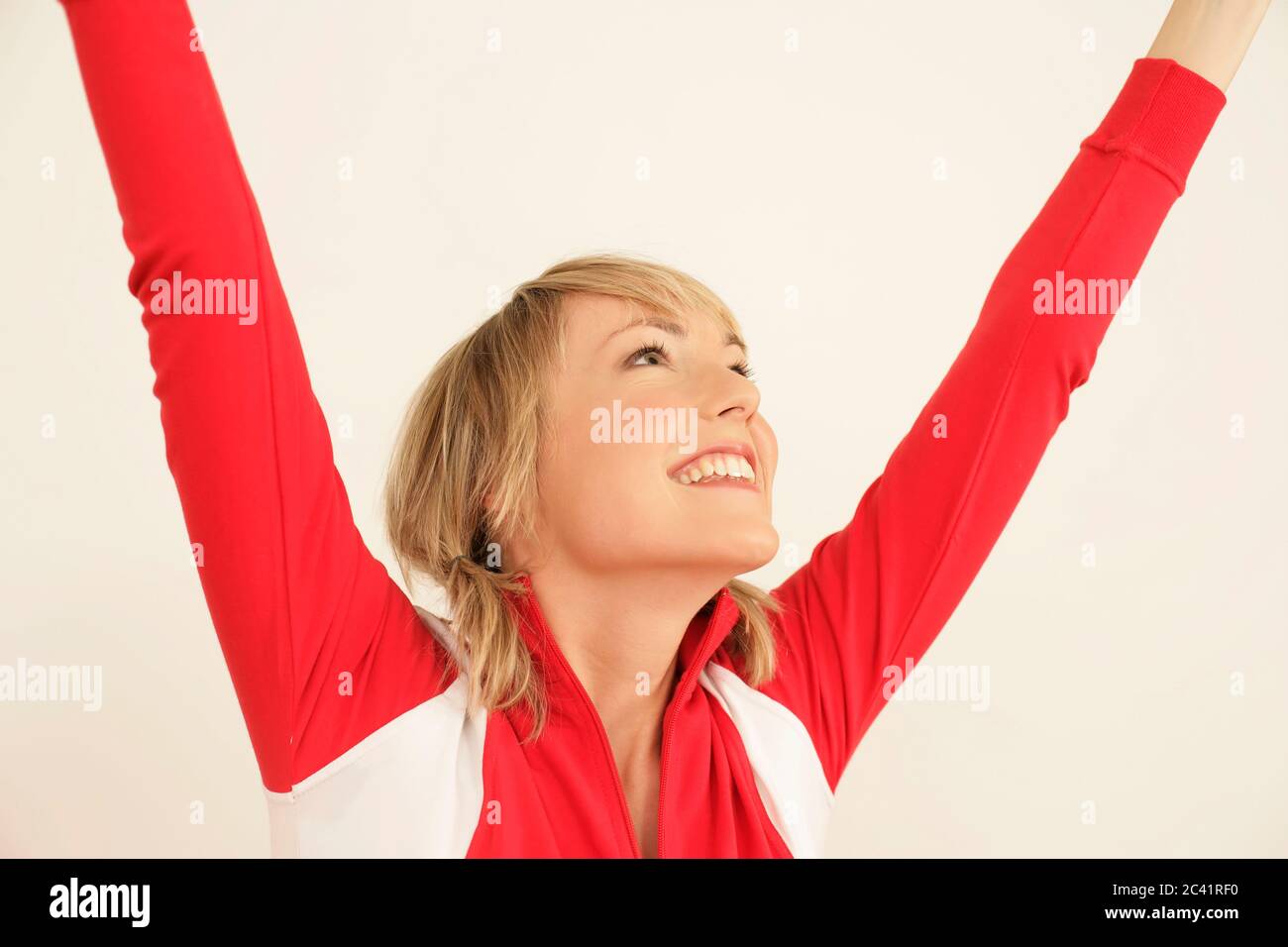 Young woman cheers Stock Photo - Alamy