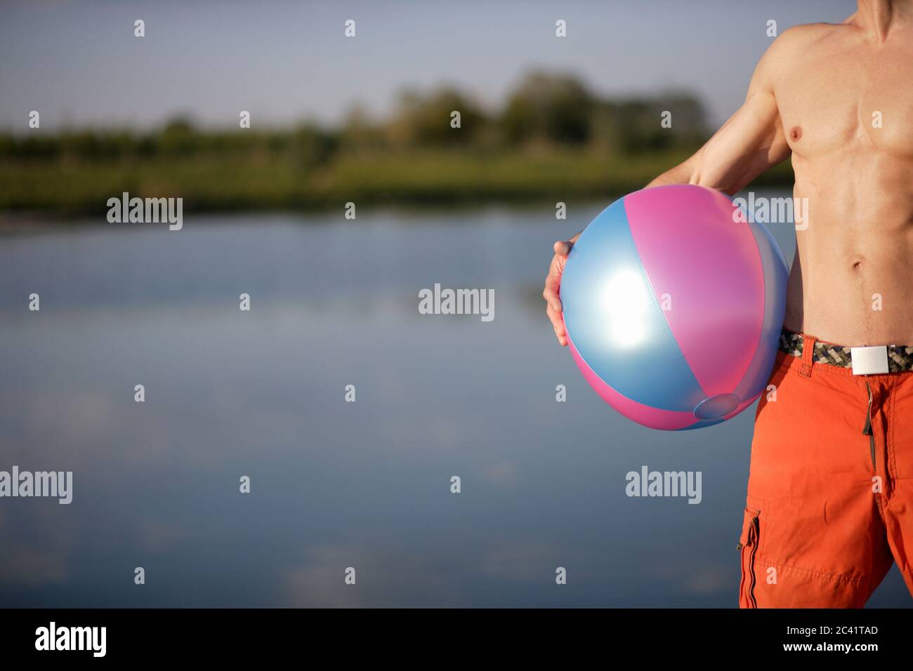 Man with a beach ball Stock Photo - Alamy
