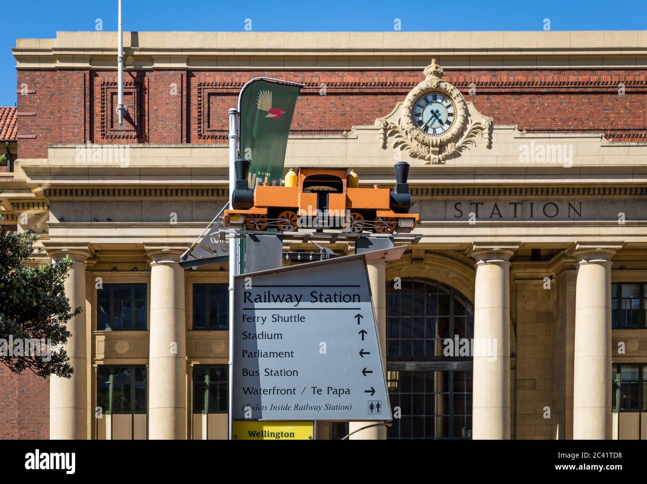 Wellington, New Zealand: Signpost, topped with a locomotive model, in ...