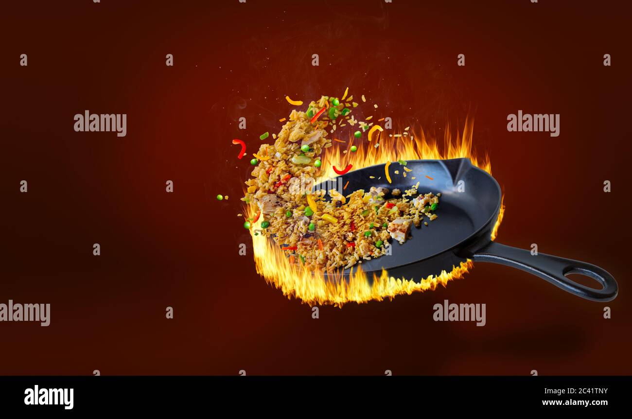 Wok throwing hi-res stock photography and images - Alamy