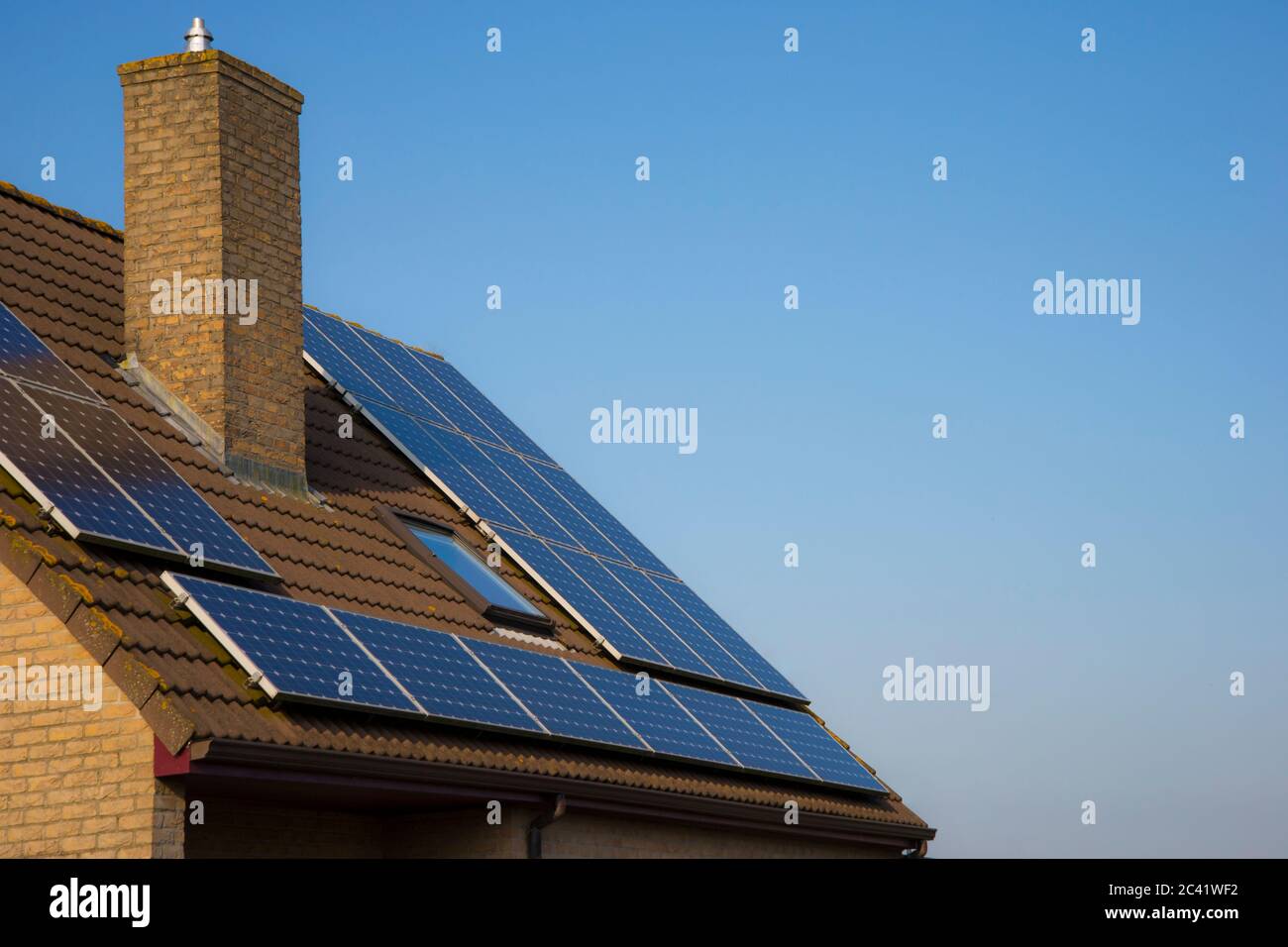 Green renewable energy. Photovoltaic solar panels on a house roof Stock ...