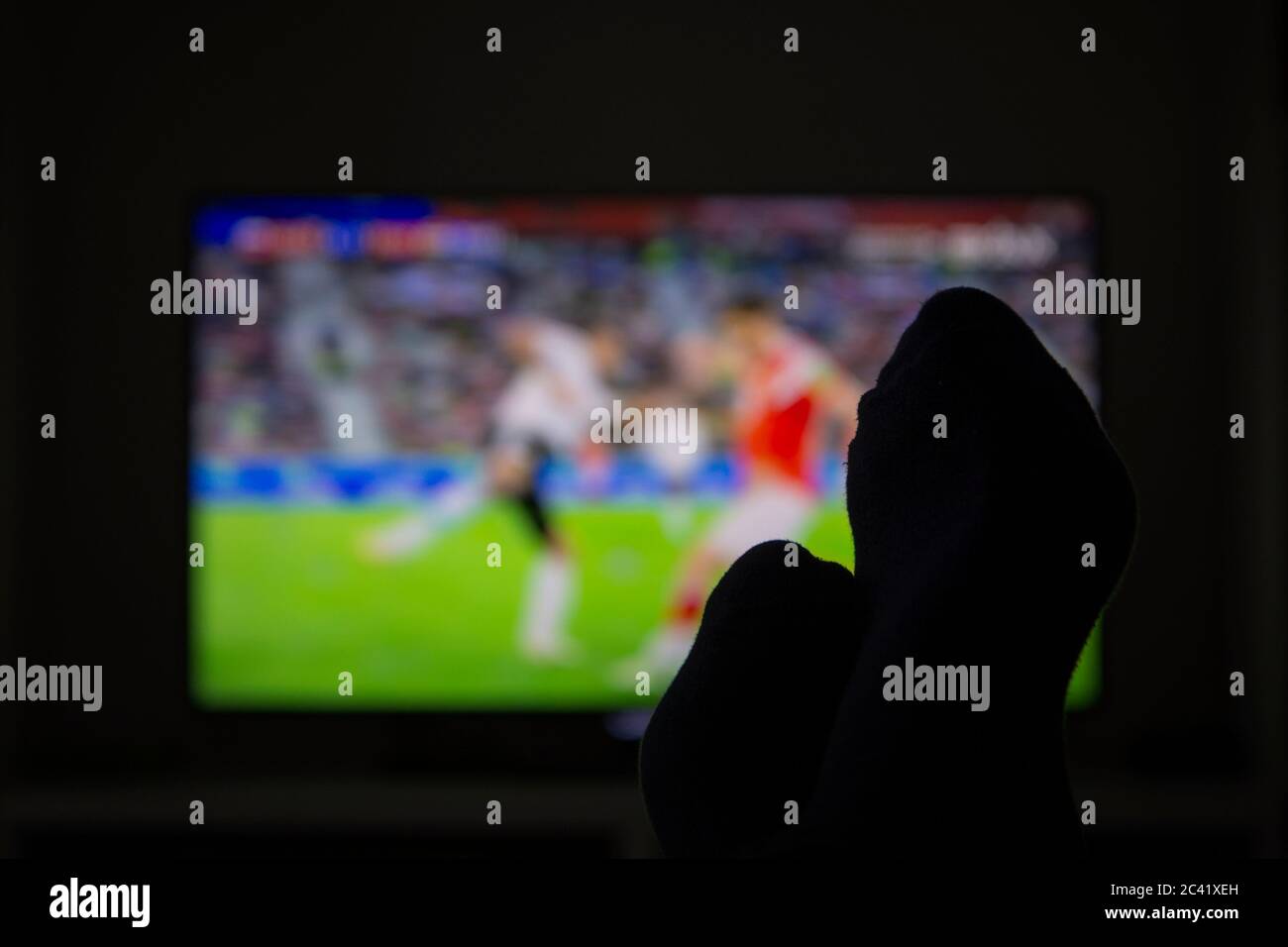 Watching football tv feet hi-res stock photography and images - Alamy