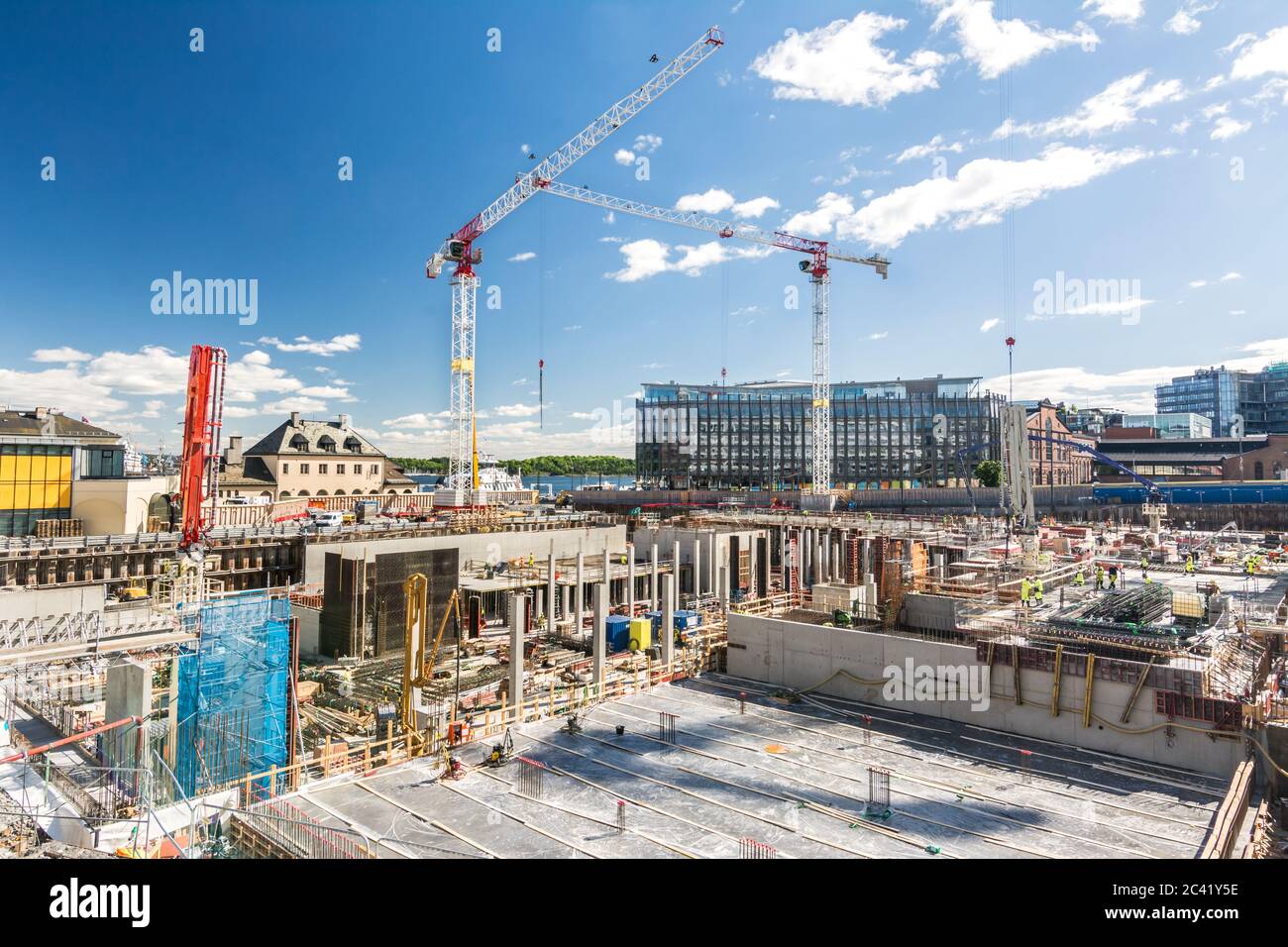 Horizontal shot of large construction site with foundations and cranes ...