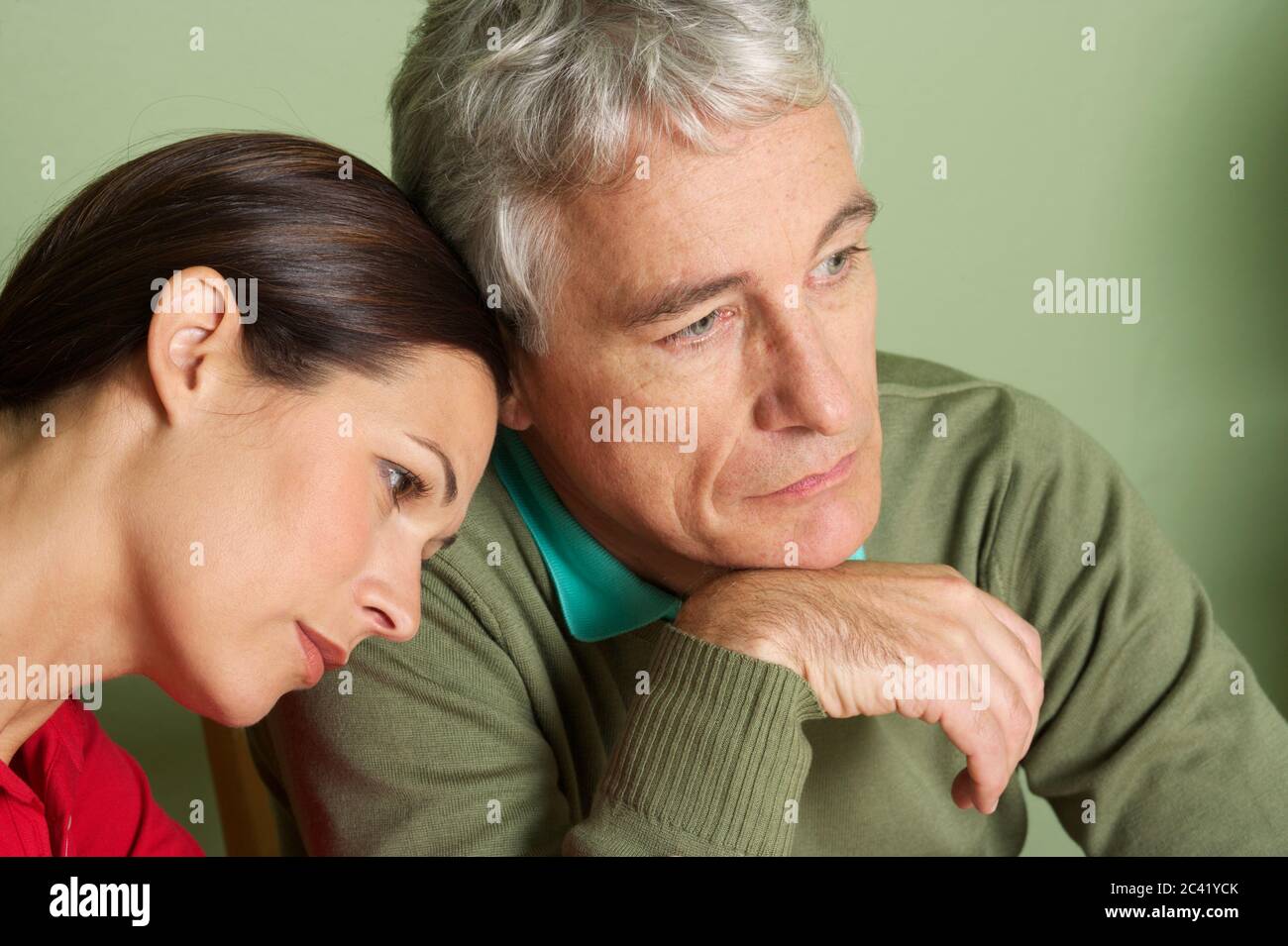 Sad woman leaning on shoulder of man Stock Photo - Alamy