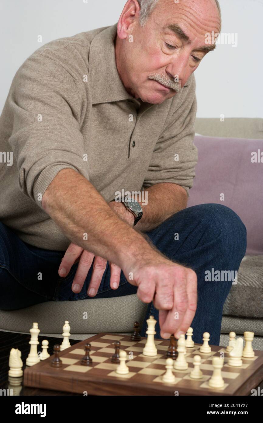 Old man plays chess Stock Photo - Alamy