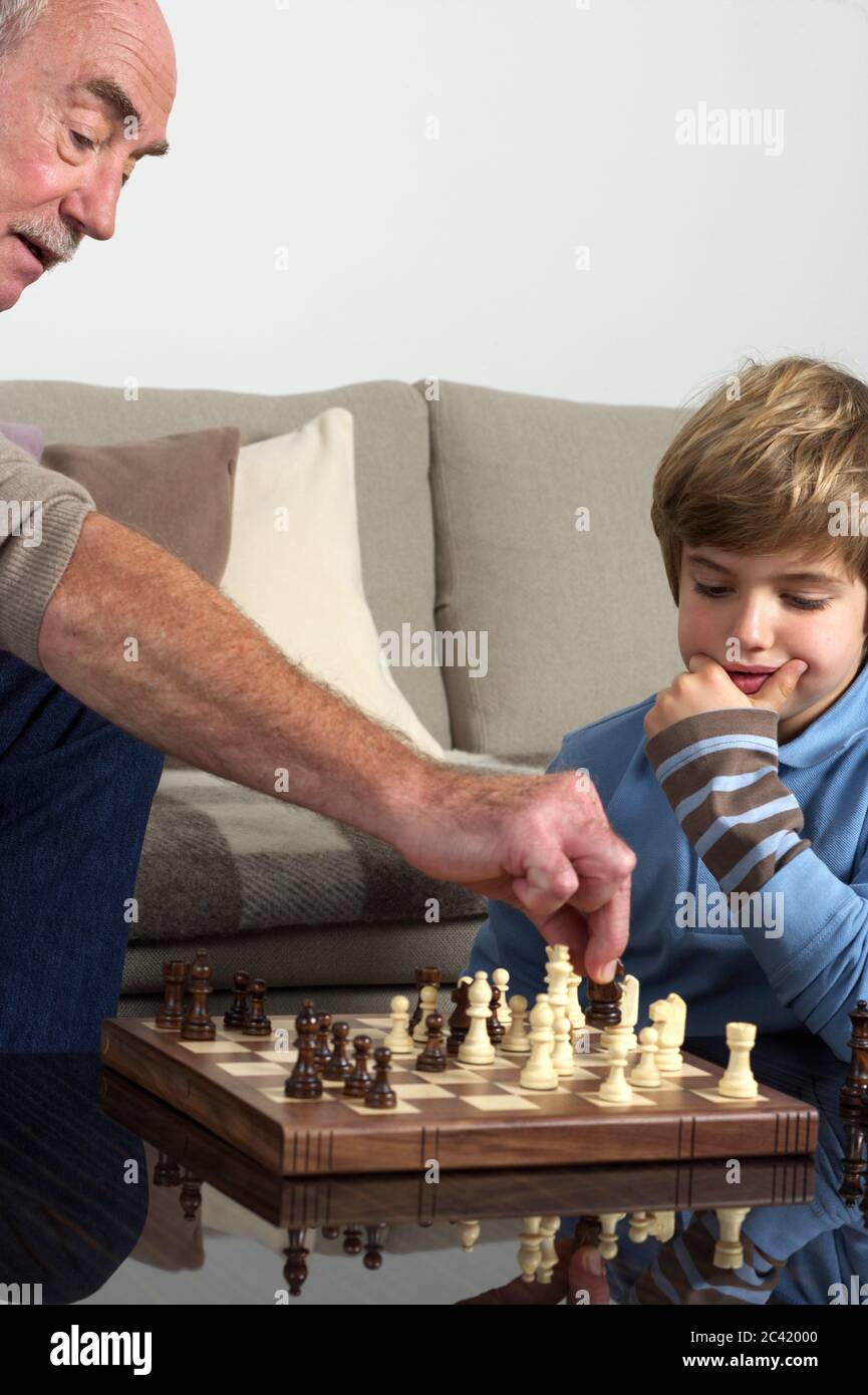 Grandpa grandson play chess hi-res stock photography and images - Alamy