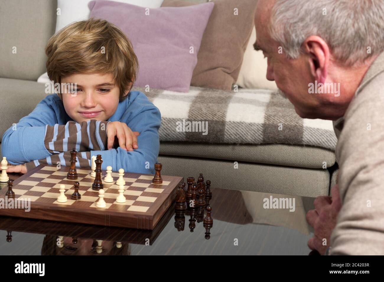 Grandpa grandson play chess hi-res stock photography and images - Alamy