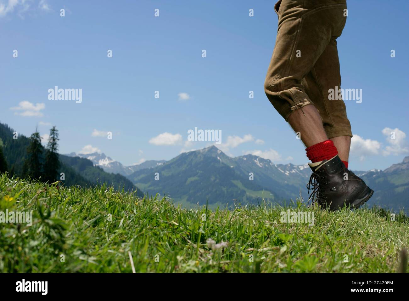 Legs of a hiker in a mountain landscape - Alps Stock Photo - Alamy