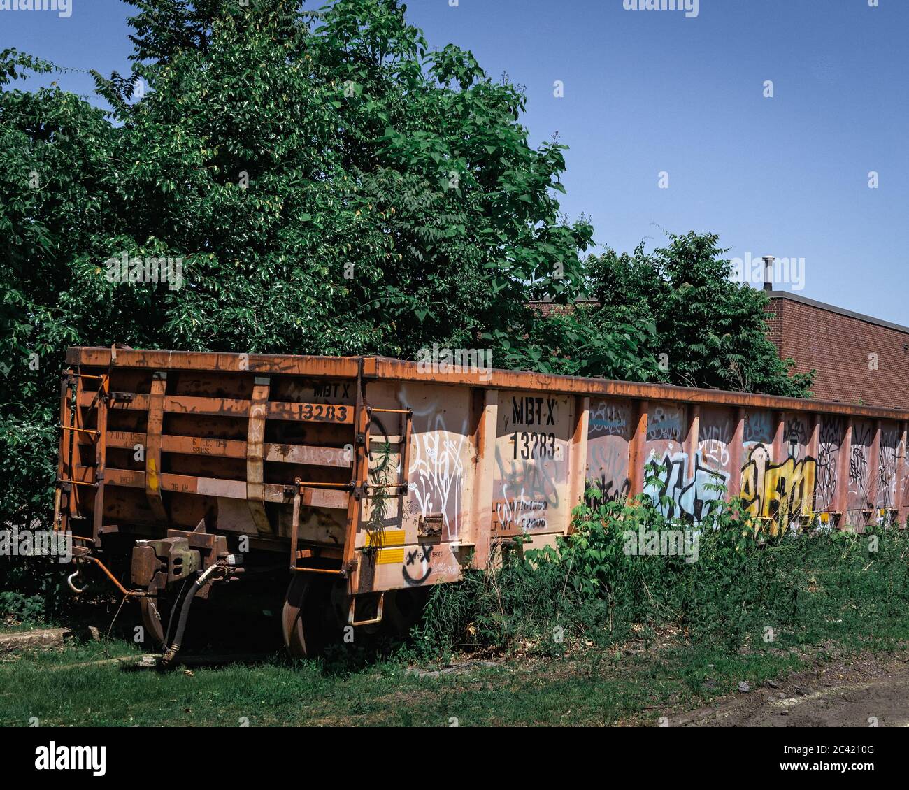 Abandoned MBTA train car covered in graffiti sits on service tracks in ...