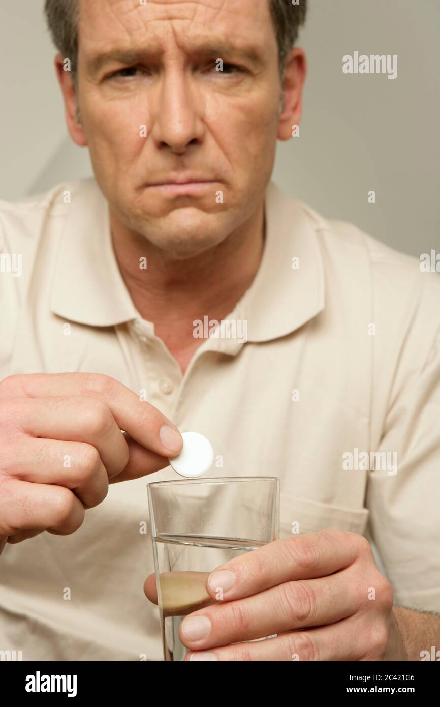Hand throws tablet water glass hi-res stock photography and images - Alamy