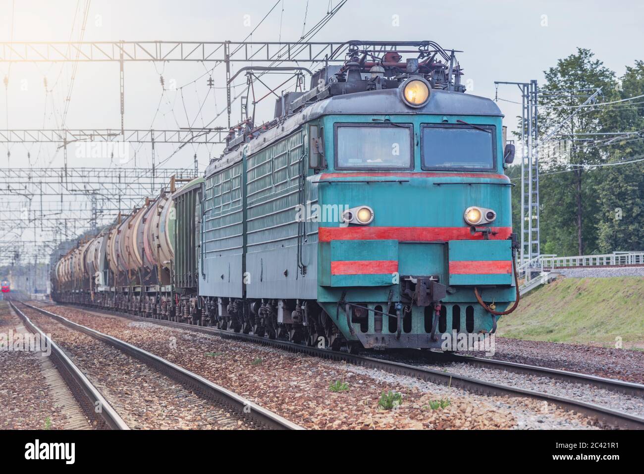 Freight train with oil approaches to the station Stock Photo - Alamy