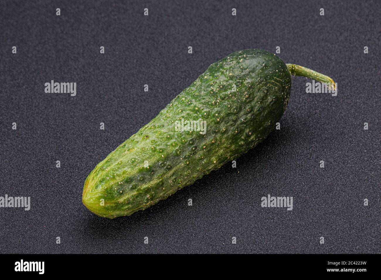 Green ripe fresh one cucumber over background Stock Photo - Alamy