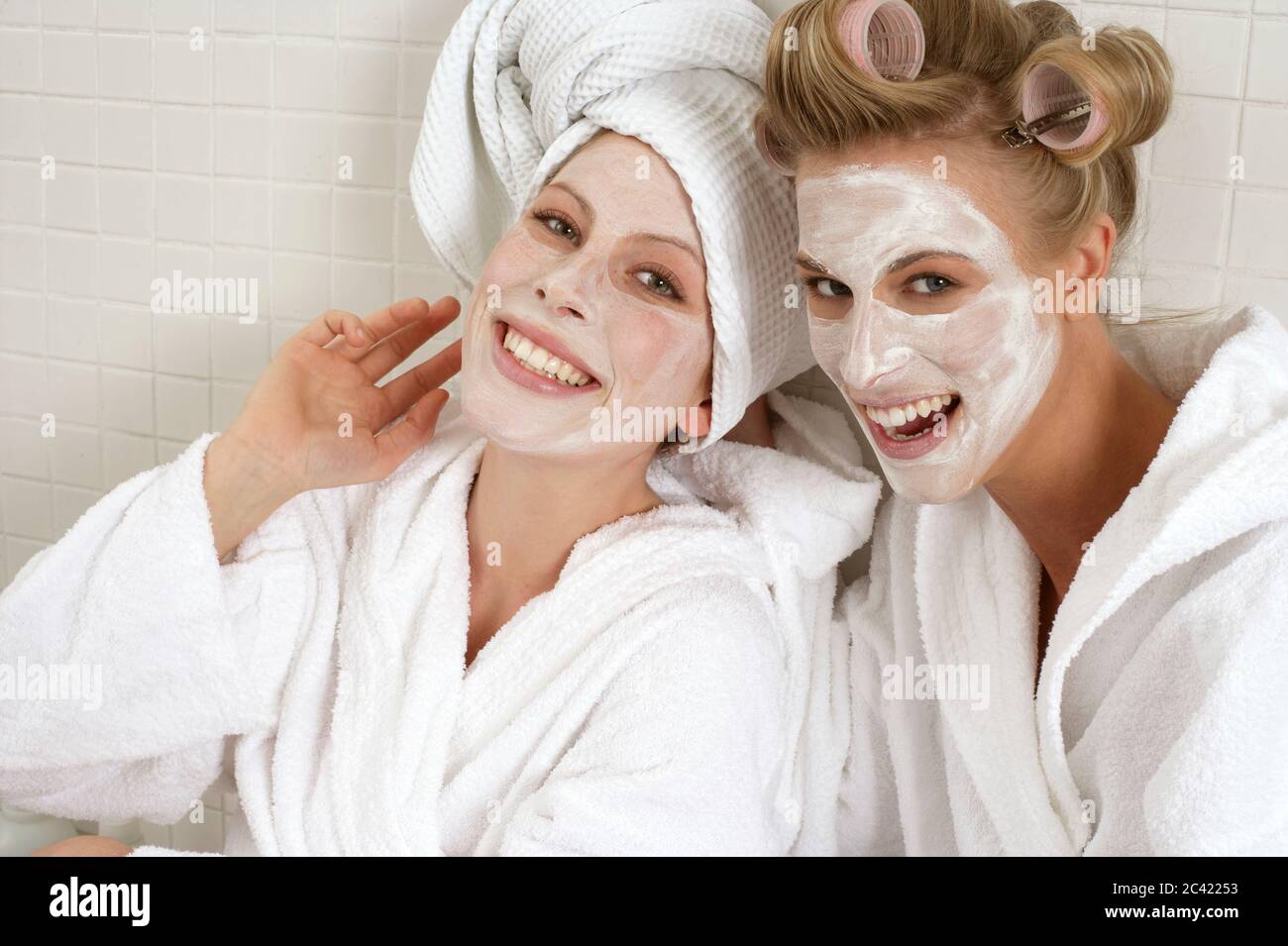 Two young women with face masks Stock Photo - Alamy