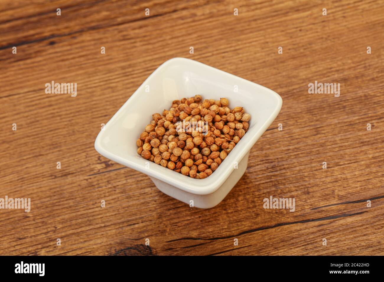 Dry Coriander seeds in the bowl Stock Photo - Alamy