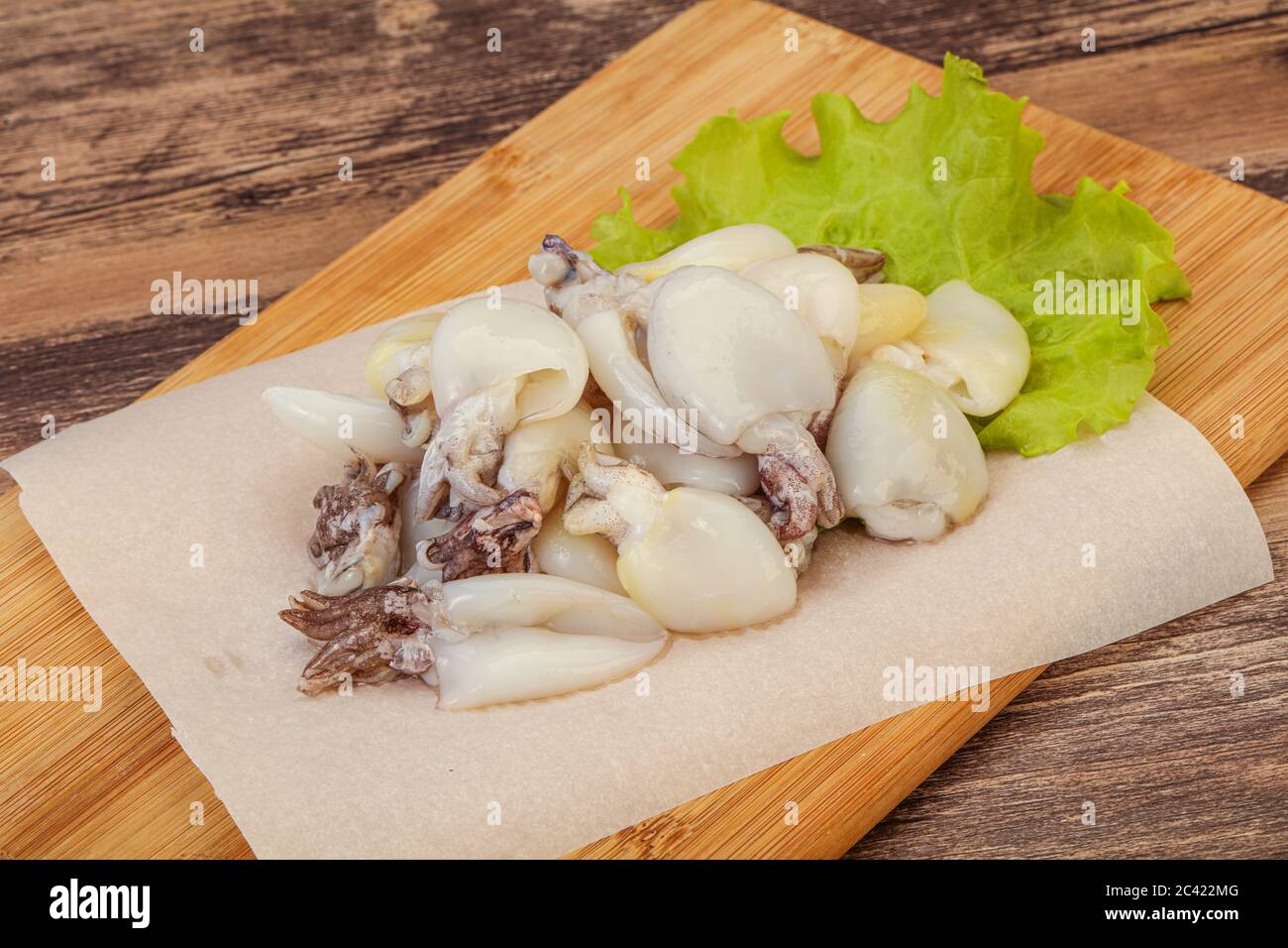 Raw seafood - cuttlefish for cooking over board Stock Photo - Alamy
