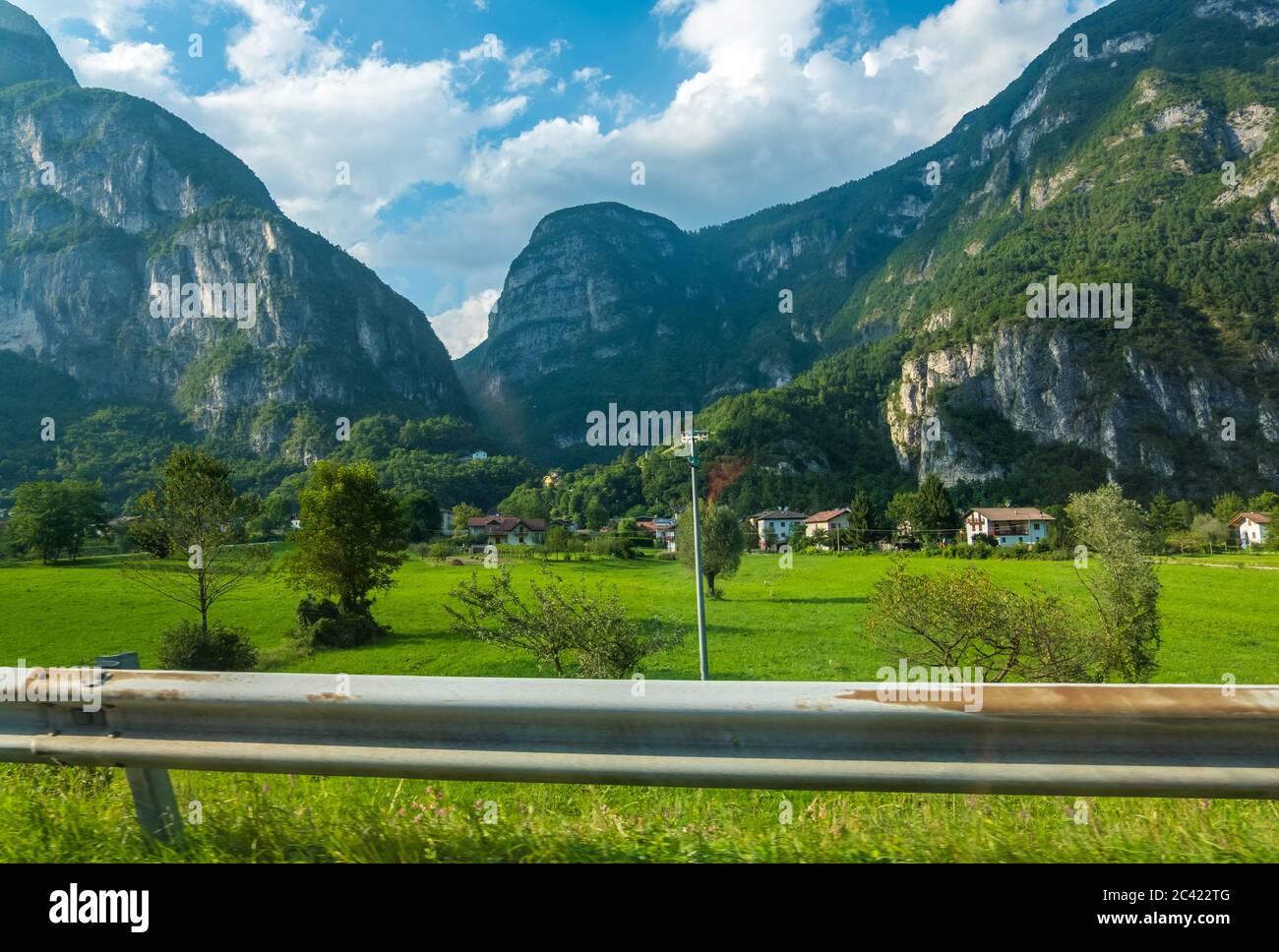 Belluno, Italy - August 11, 2019: Landscape with houses are surrounded ...