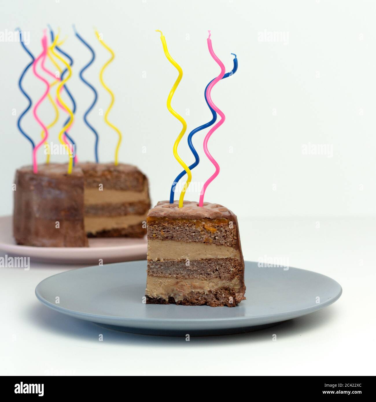 Homemade chocolate birthday cake with curves colorful candles Stock ...