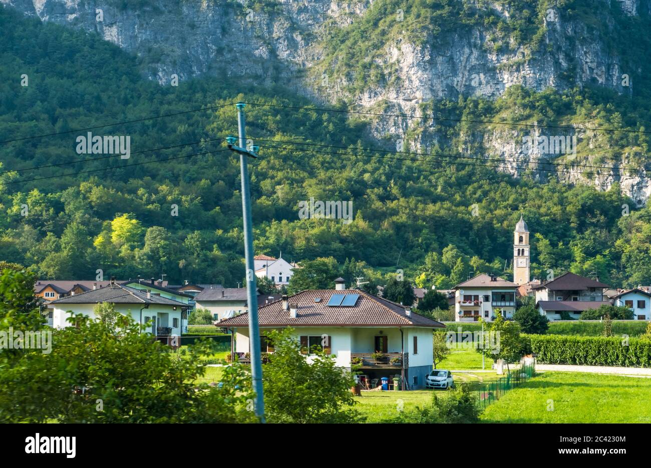 Belluno, Italy - August 11, 2019: Landscape with houses are surrounded ...