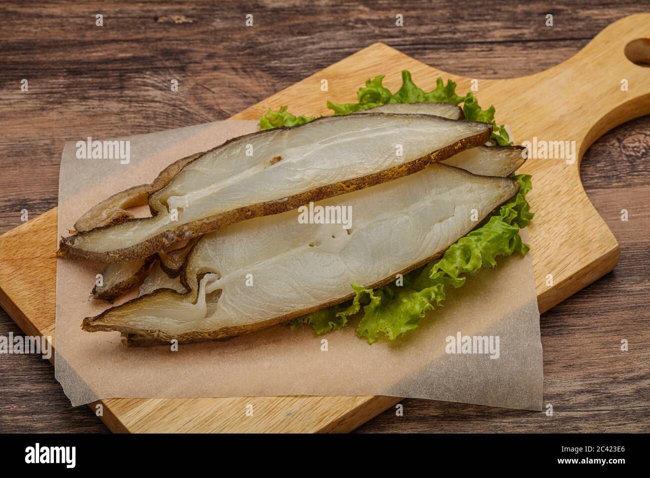 Delicous smoked halibut fish slices snack Stock Photo - Alamy