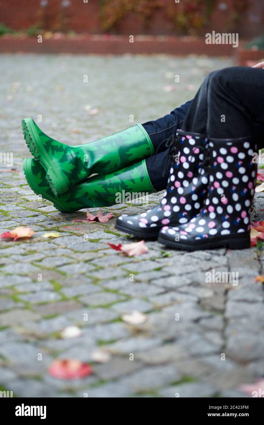 Rubber boots on pavement Stock Photo - Alamy
