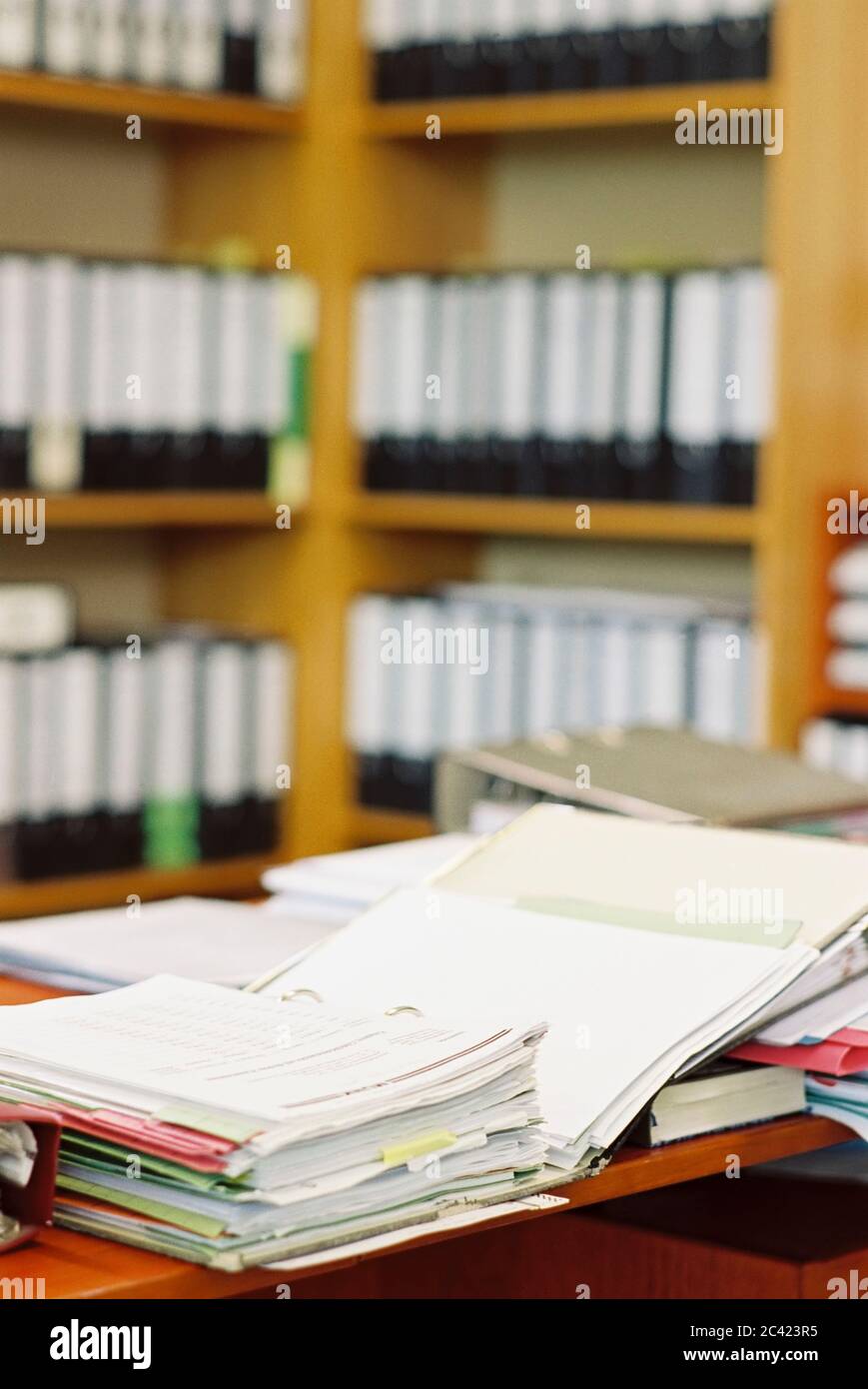 Open file folder lies on a desk Stock Photo - Alamy