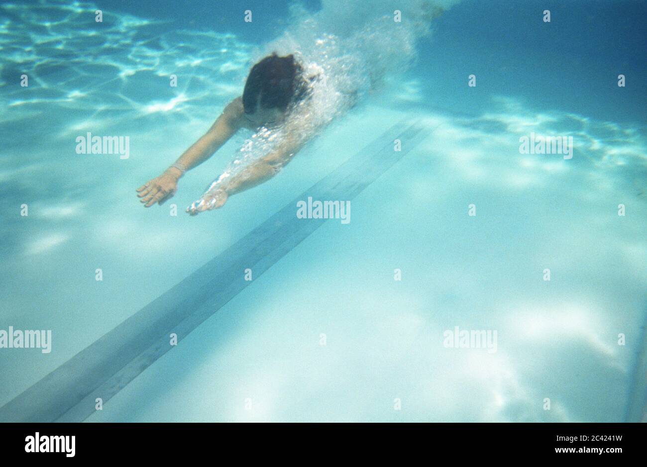 Woman dives swimming pool hi-res stock photography and images - Alamy