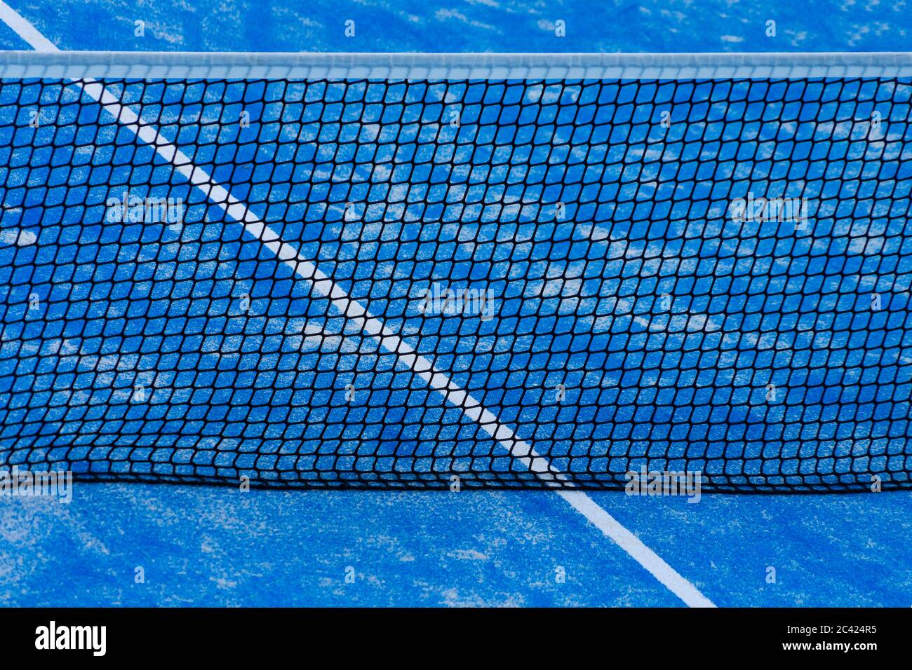 Paddle tennis net and blue court field background. Close up Stock Photo ...